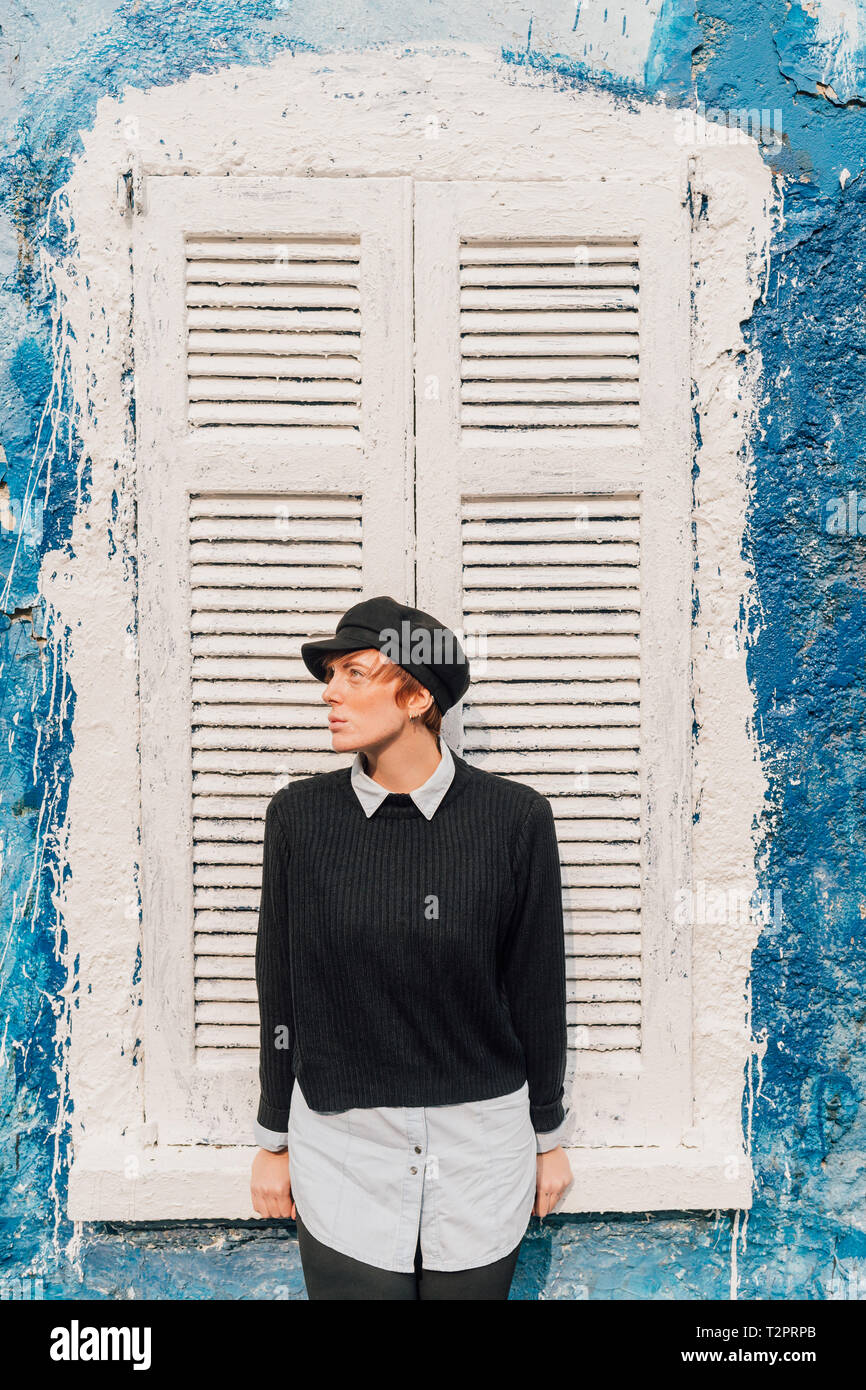 Portrait of woman, shutters in background Stock Photo - Alamy