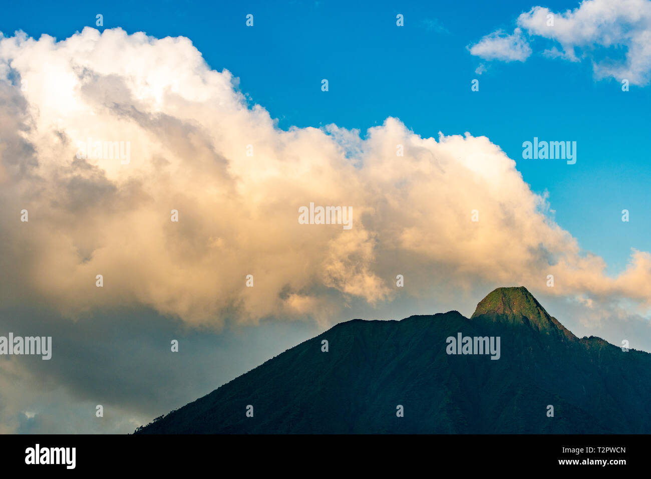 Summit of Mount Sabyinyo with clouds hanging above, Volcanoes National ...