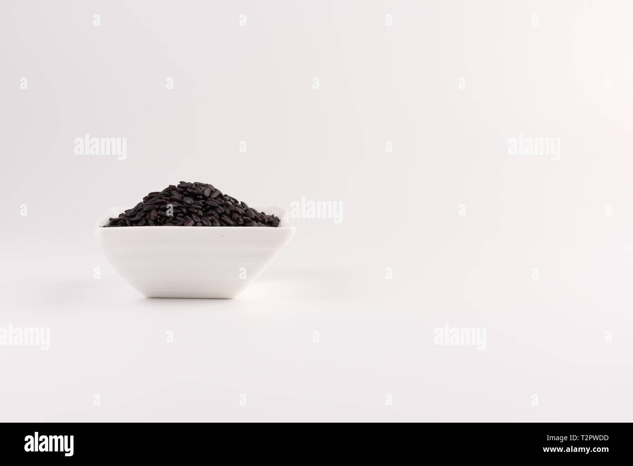 bowl of black wild rice isolated on white background Stock Photo - Alamy