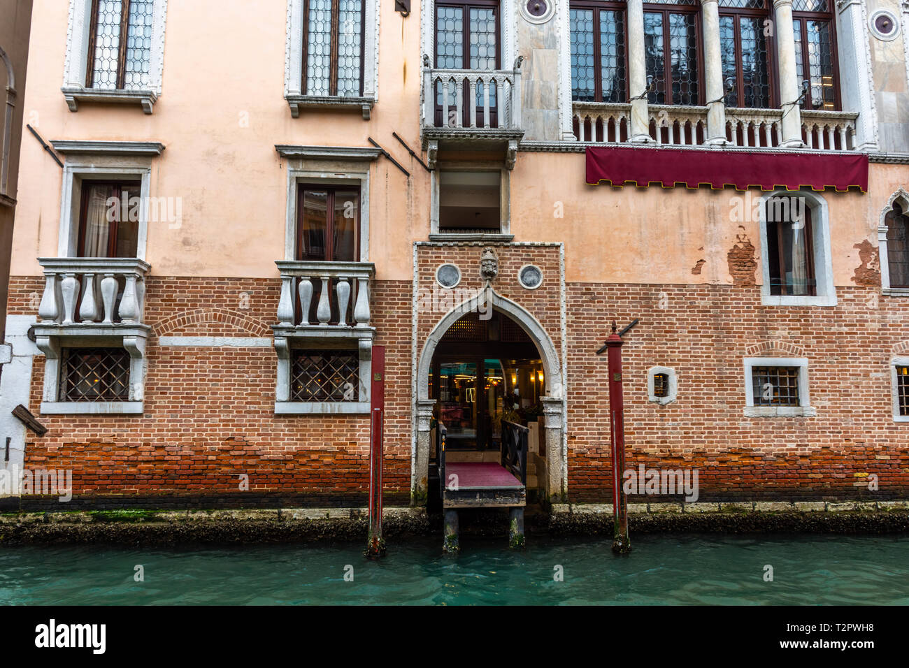 Canal in Venice with traditional old houses, Italy Stock Photo - Alamy