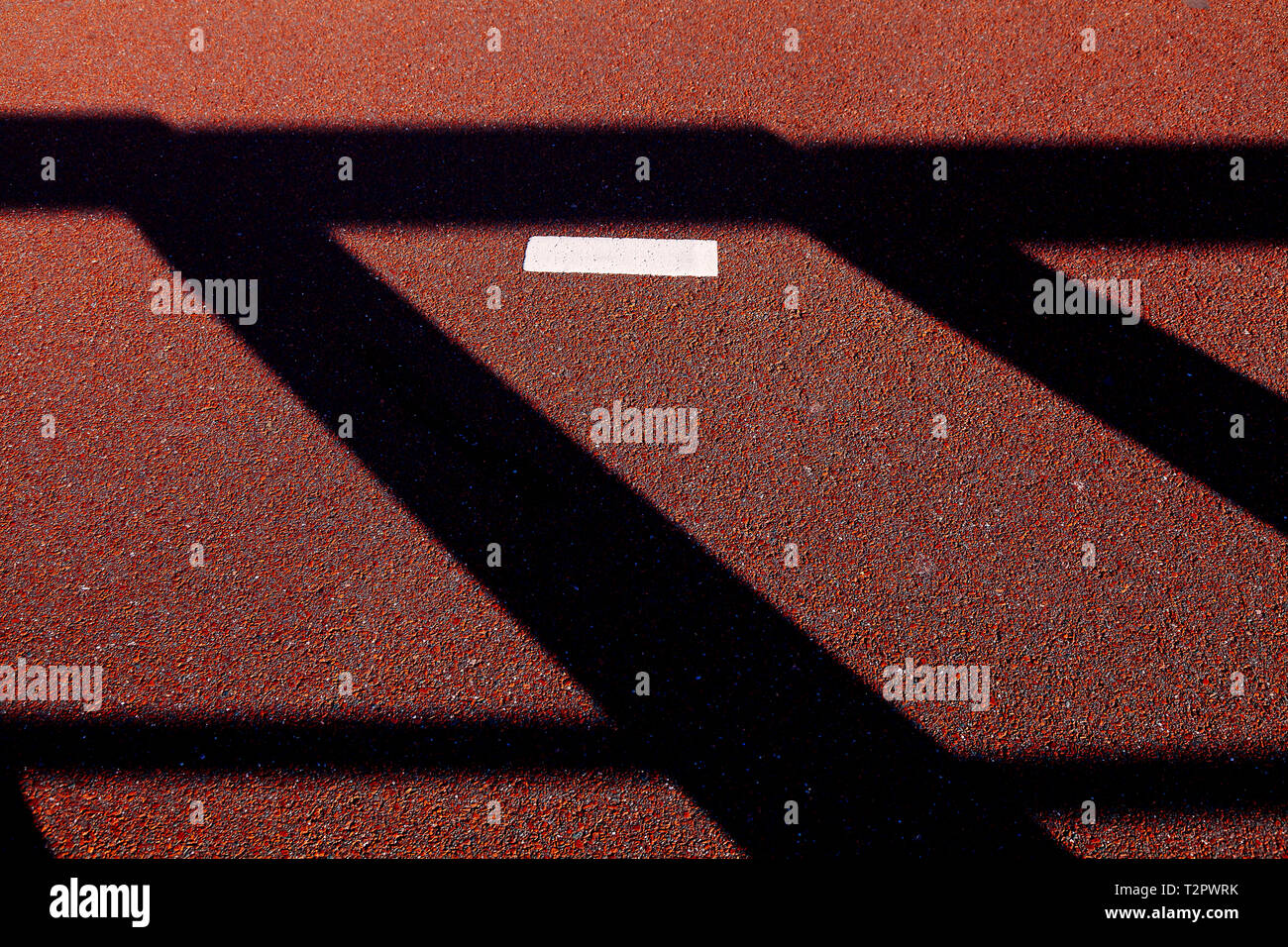 Dark shadows on a brown asphalt. Light and shadow, street, abstract ...