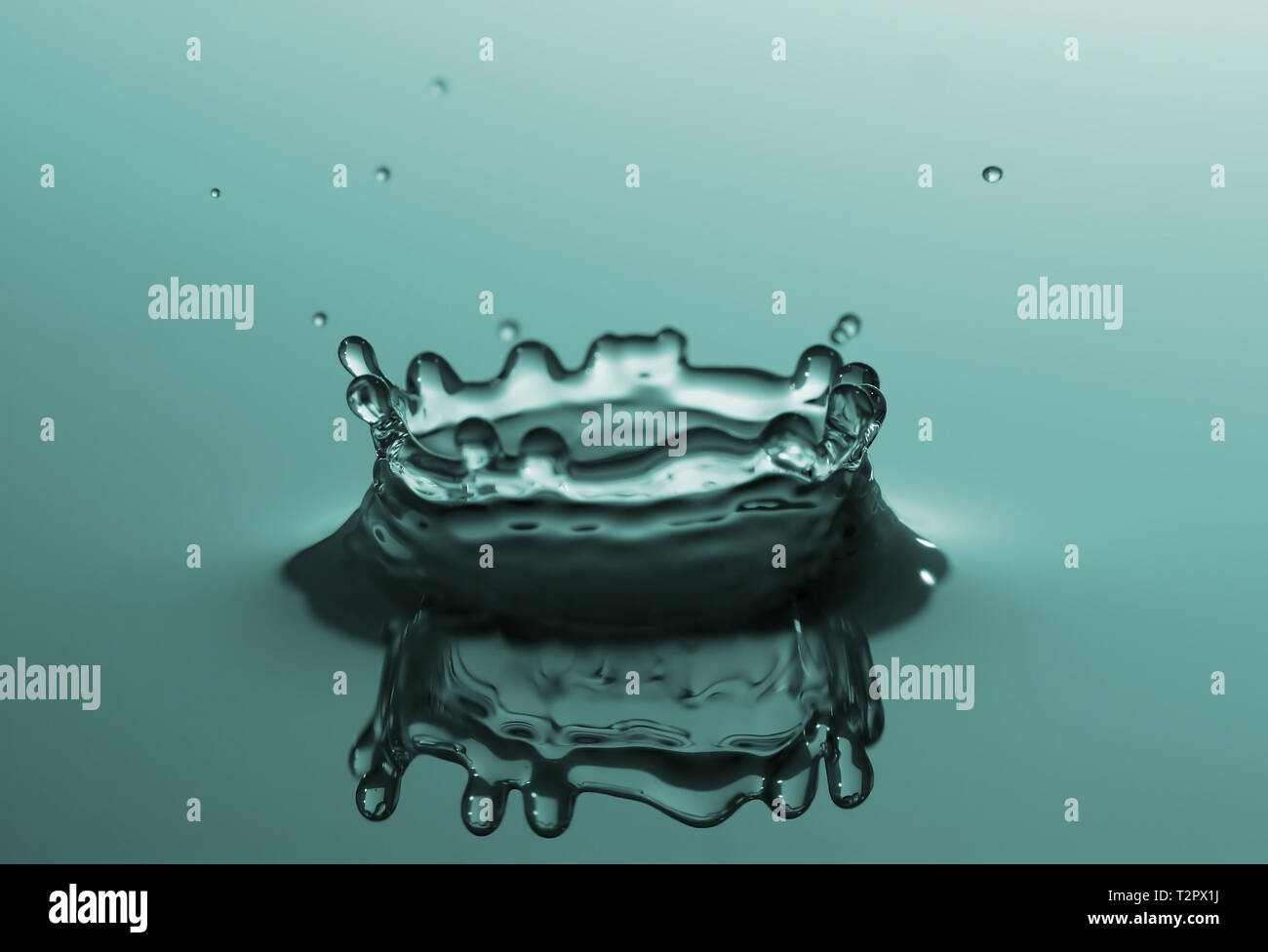 Blue water splash in shape of crown Stock Photo - Alamy