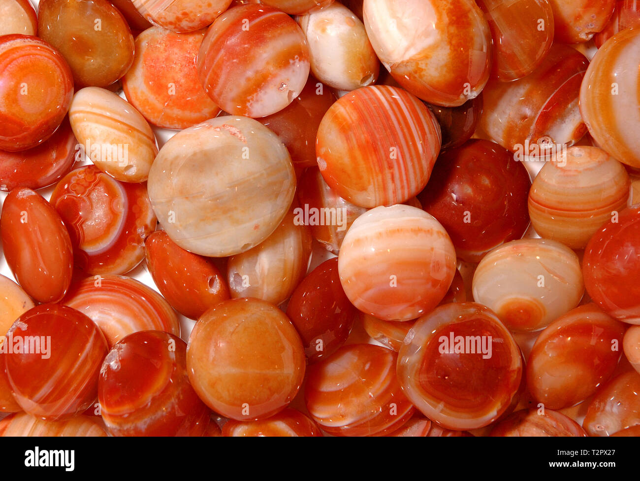 Texture, a mix of orange gemstones Stock Photo - Alamy