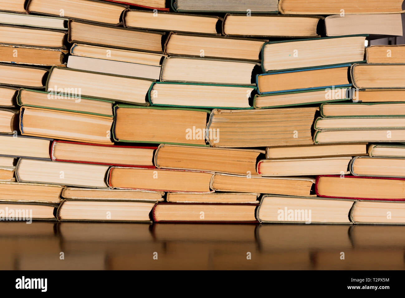 Stack of books background. many books piles Stock Photo - Alamy