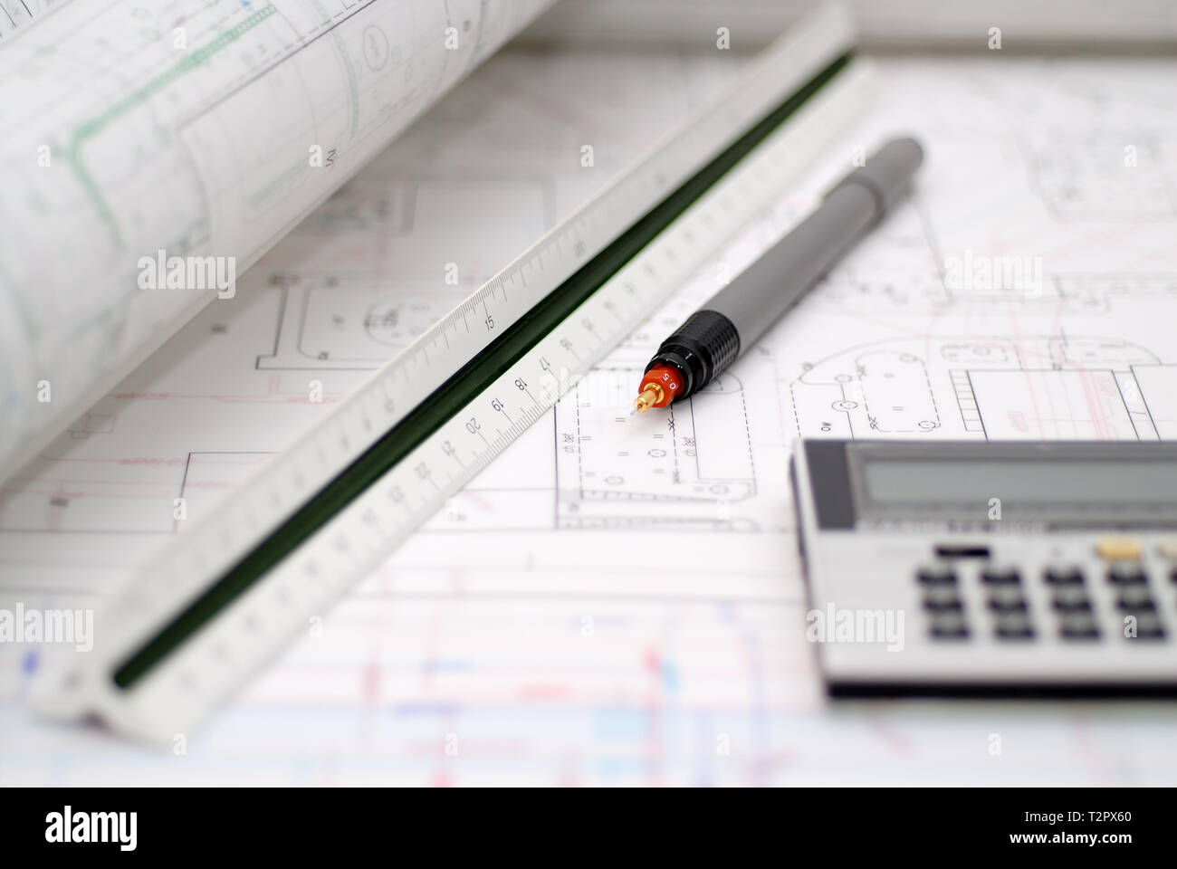 Architectural plans, calculator and drawing utensils Stock Photo - Alamy