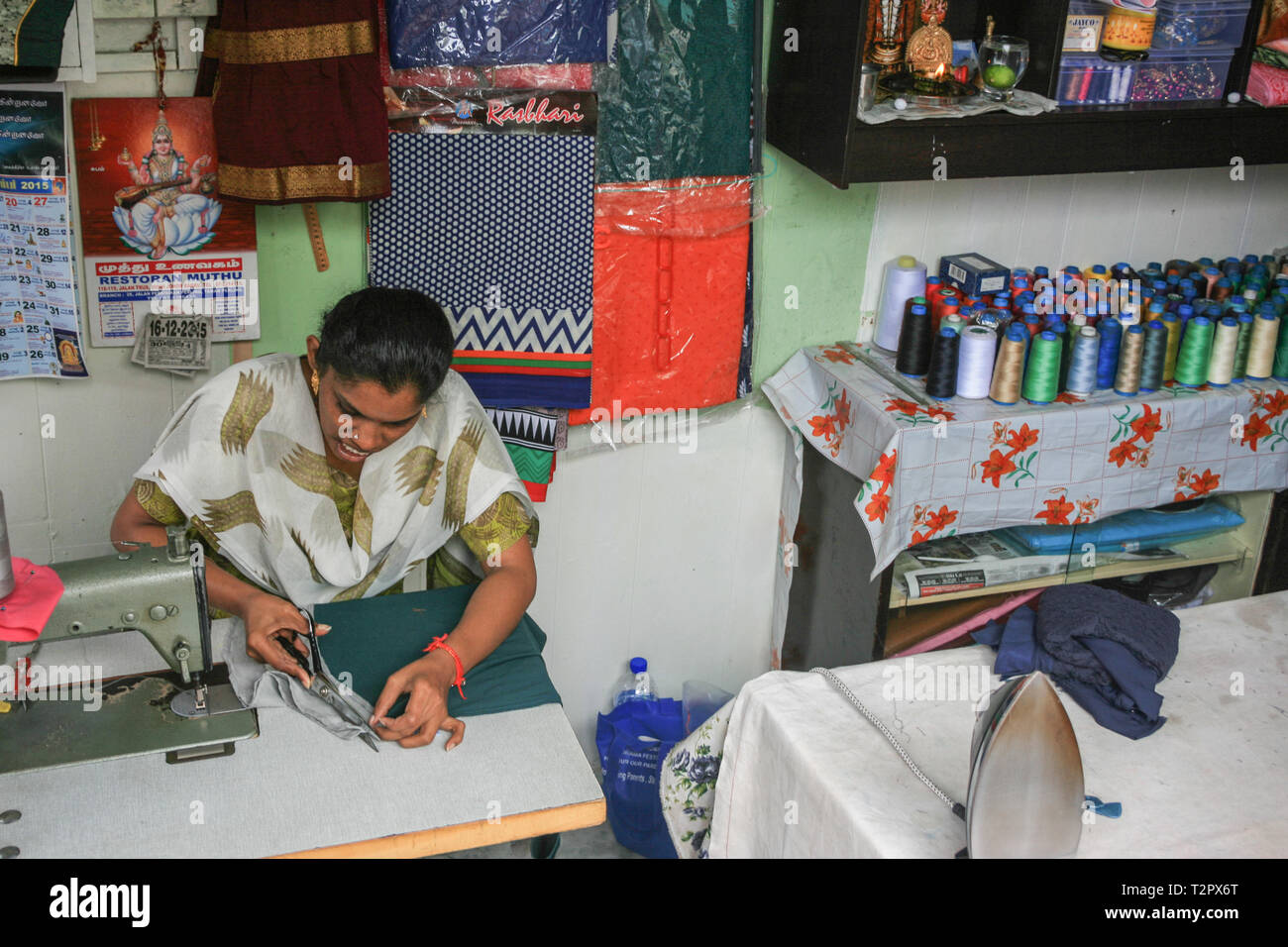 Traditional dressmaker in the heritage area of Johor Bahru, Malaysia ...