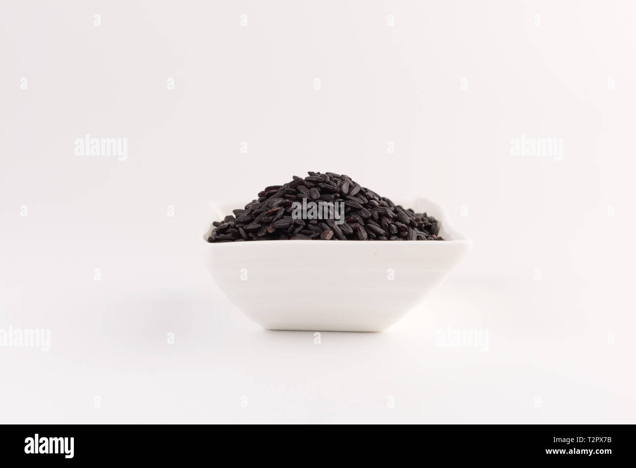 bowl of black wild rice isolated on white background Stock Photo - Alamy