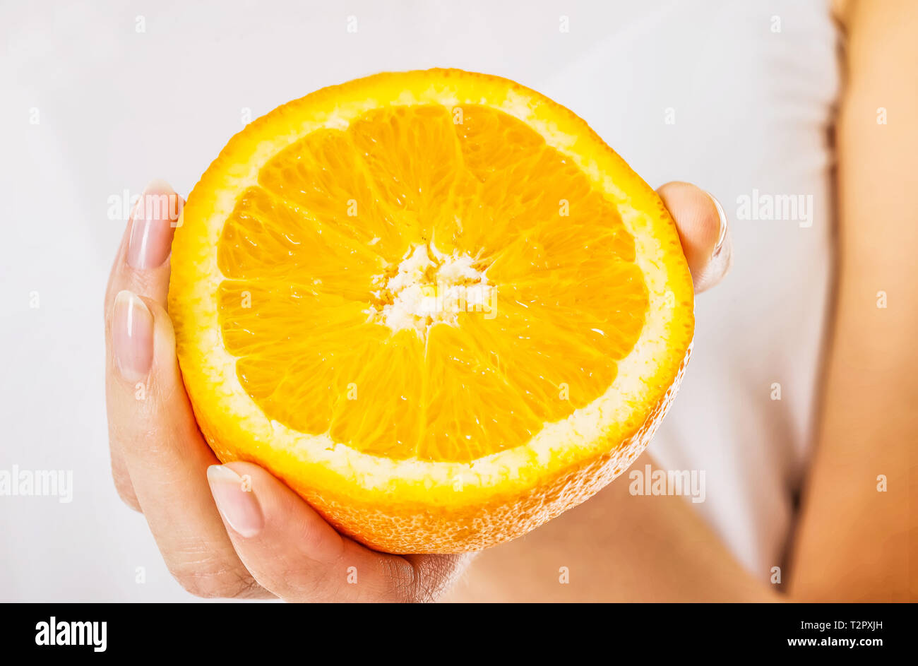 Fruit held in fingers hi-res stock photography and images - Alamy