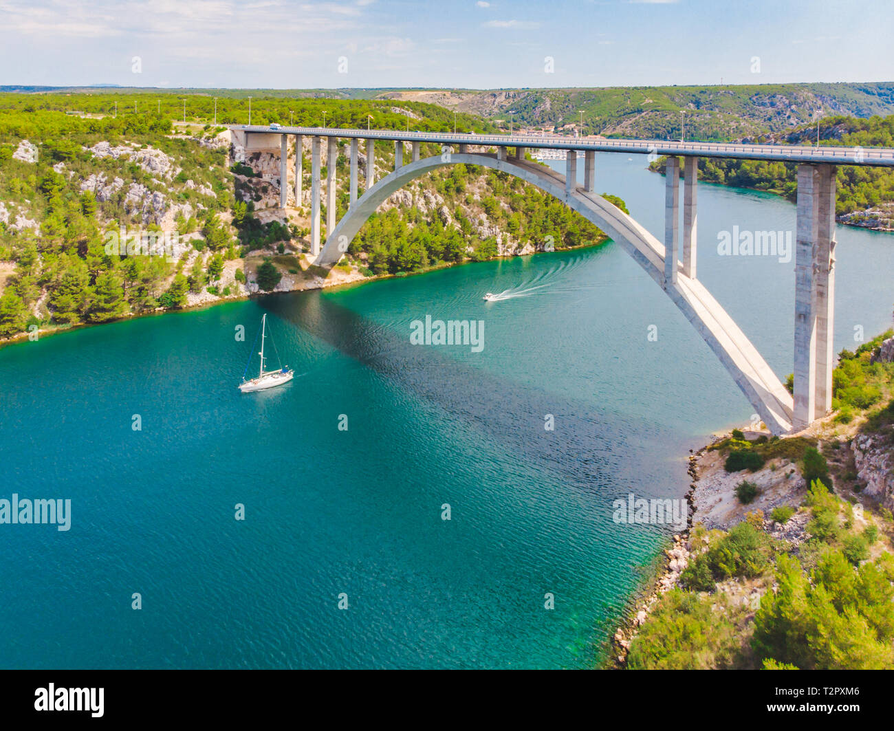 highway bridge cross river with blue water. summer time. vacation ...