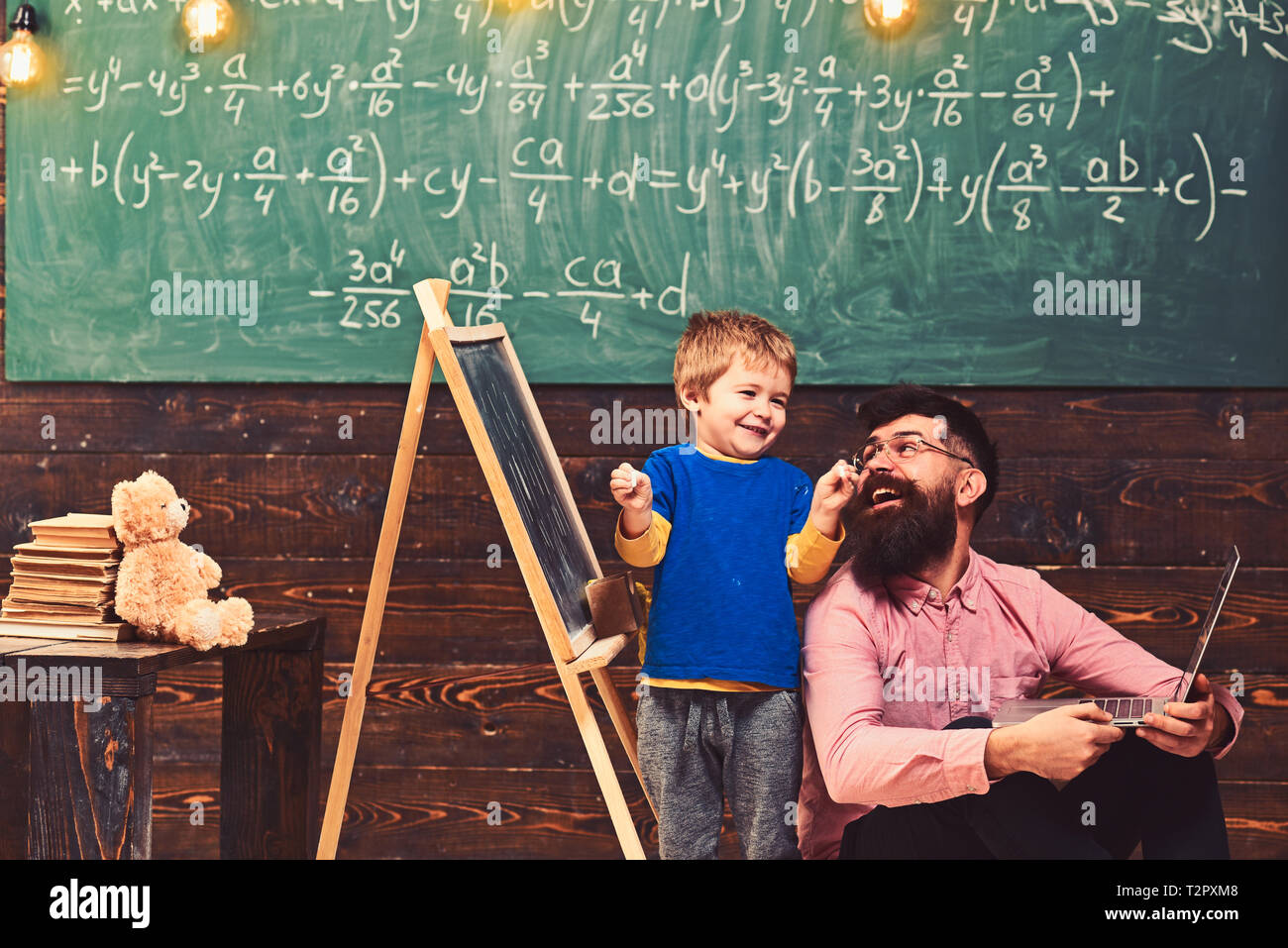 Blond schoolboy in classroom hi-res stock photography and images - Alamy