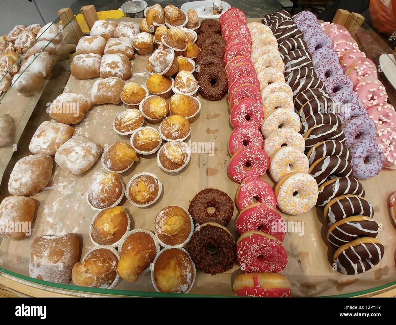 wide image inside bakery pastry shop store with lot of different baking ...
