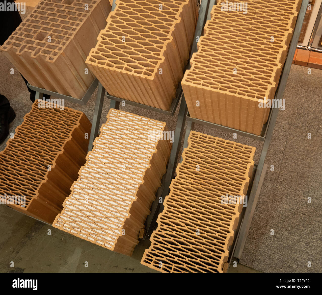 side closeup view on modern types of building red brick with different ...