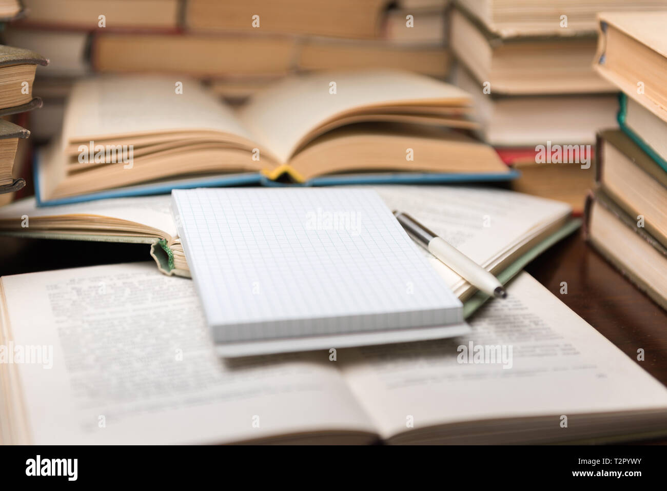 Education learning concept with open book and notebook on the table ...