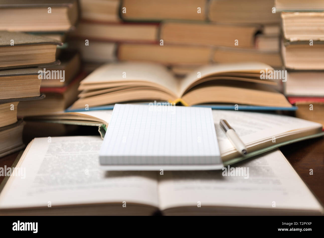 Education learning concept with open book and notebook on the table ...