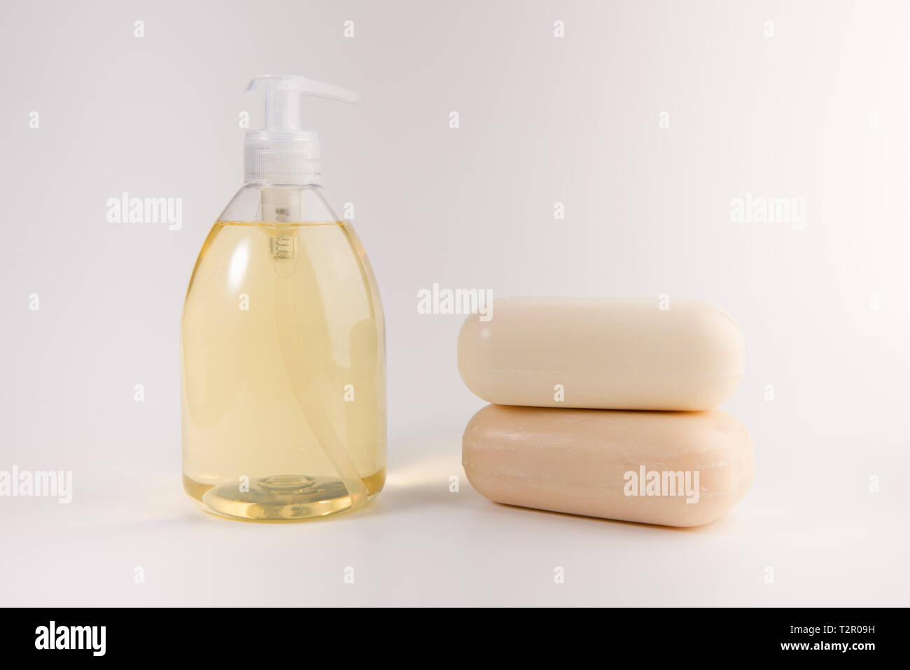 liquid soap and two pieces of solid soap isolated on white background ...