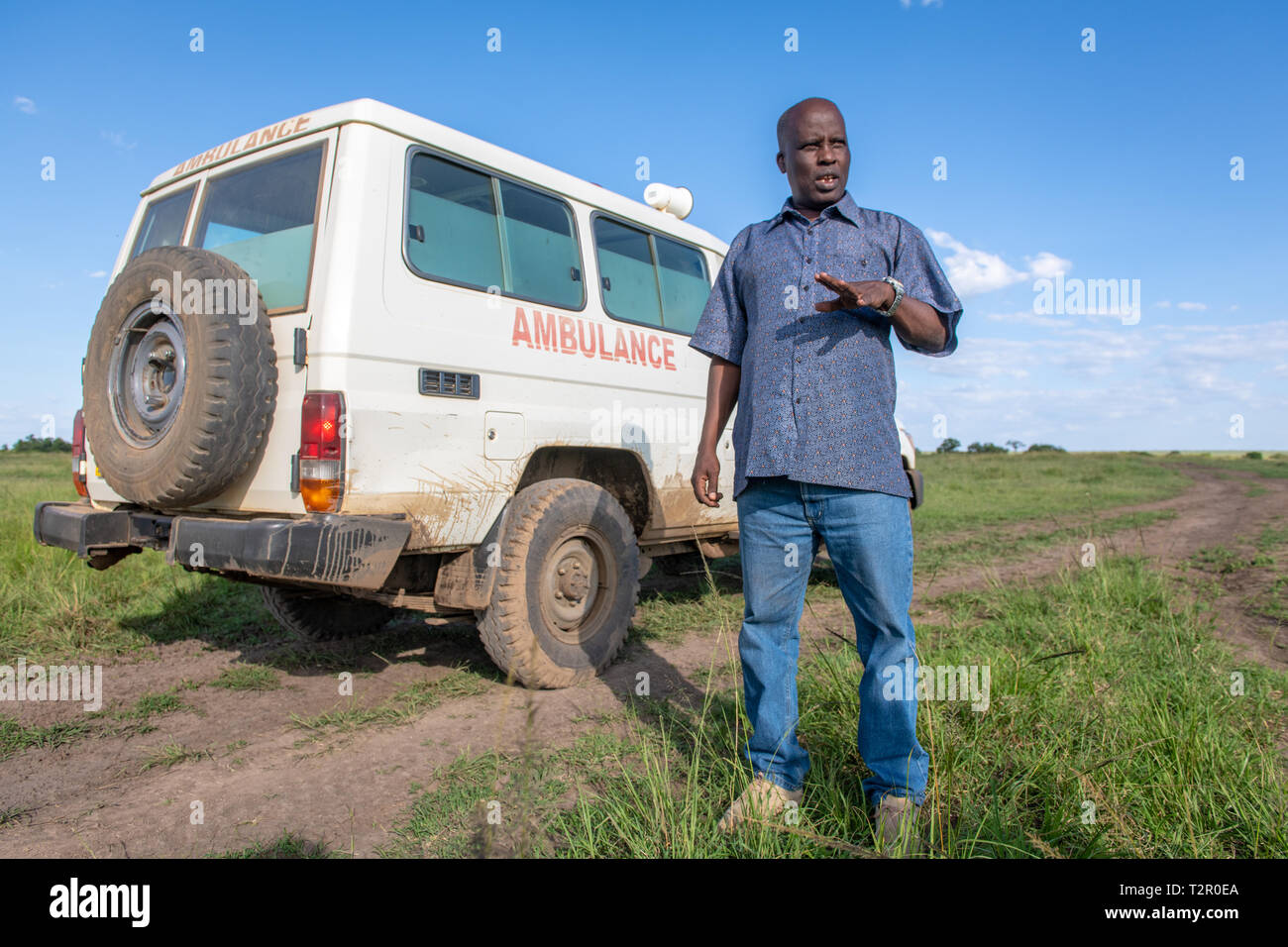 A man stands next to an ambulance truck at the Maasai Mara National ...