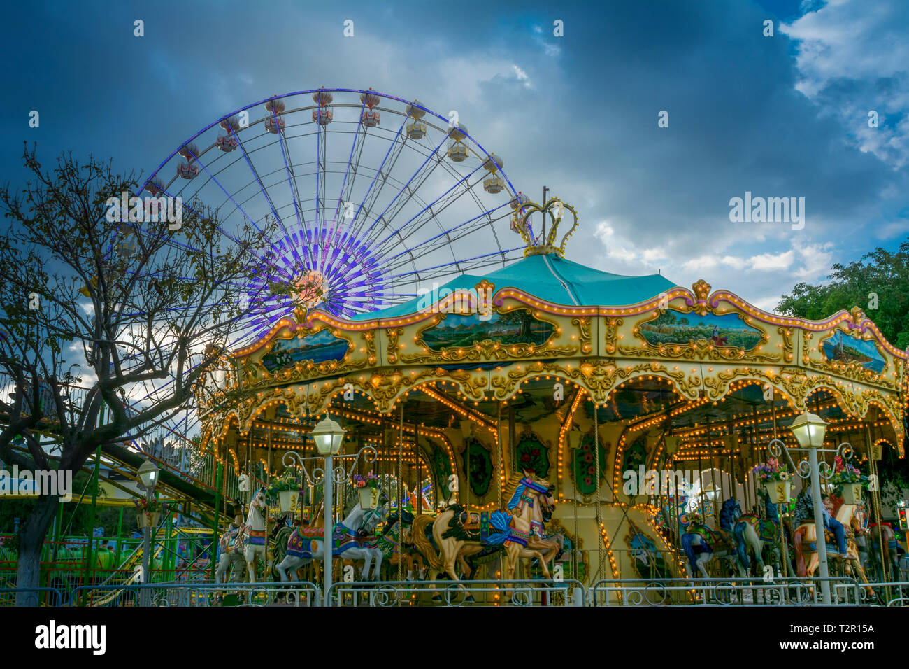 Merry go round and Ferris wheel Stock Photo - Alamy