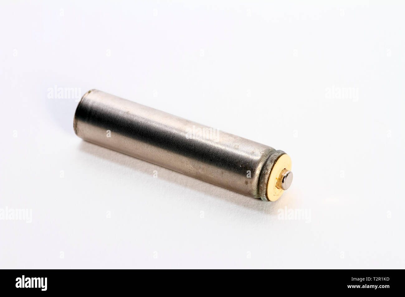 Single battery cell isolated on a white background Stock Photo - Alamy