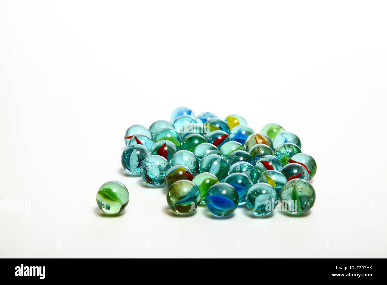 Group of glass marbles isolated on a white background Stock Photo - Alamy