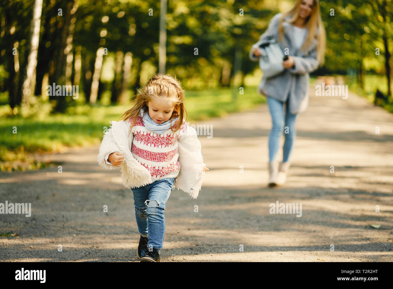 Little girl running behind little hi-res stock photography and images ...
