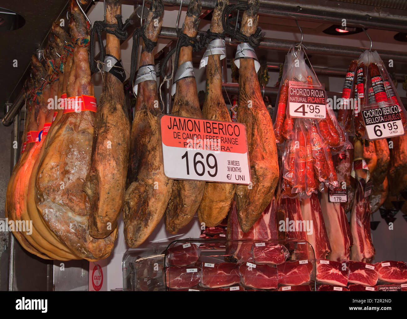 Hanging pig legs in market hi-res stock photography and images - Alamy