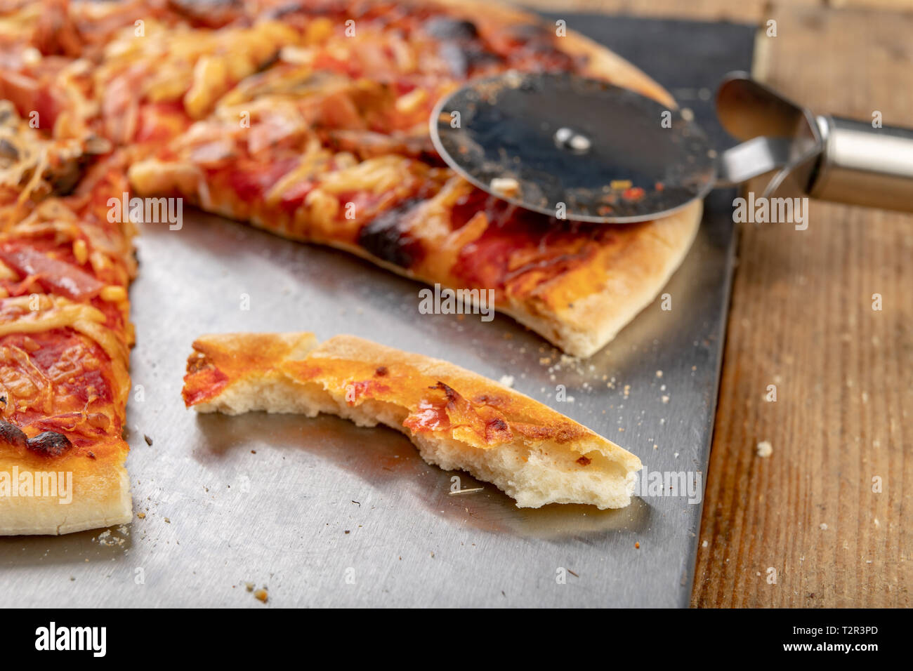 Pizza from the market and a knife for cutting the pizza. Fast food ...