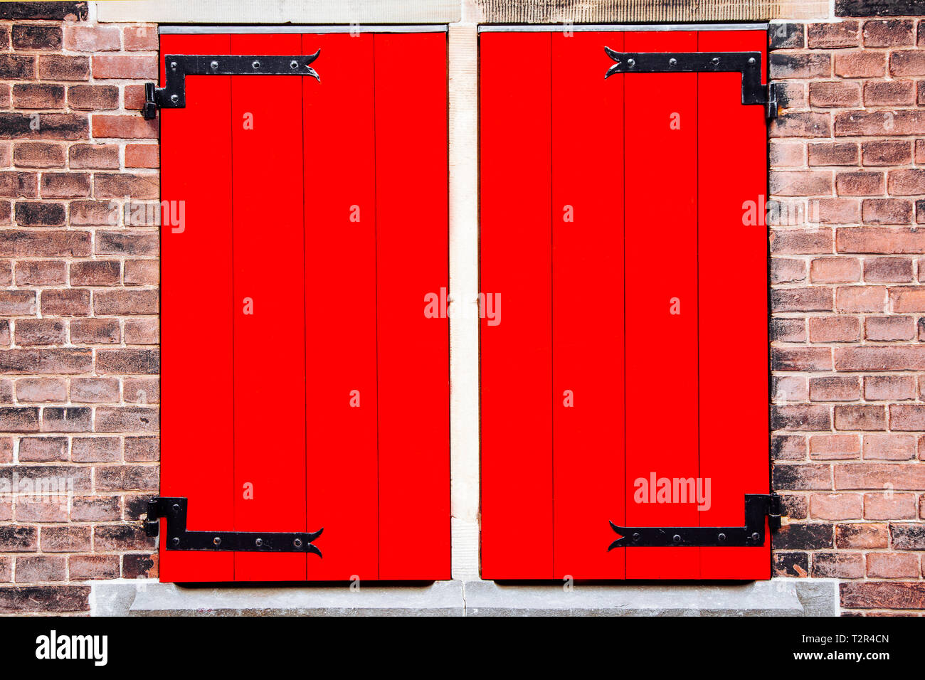 Closed red window with black wrought iron. Red Window shutters, brown ...