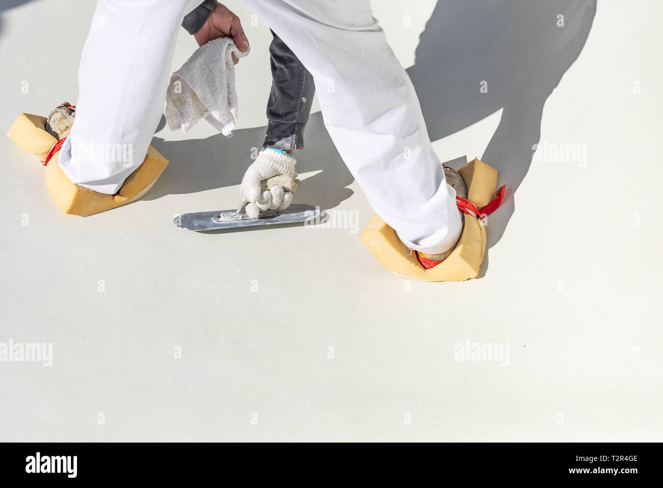 Construction worker applying plaster on hi-res stock photography and ...