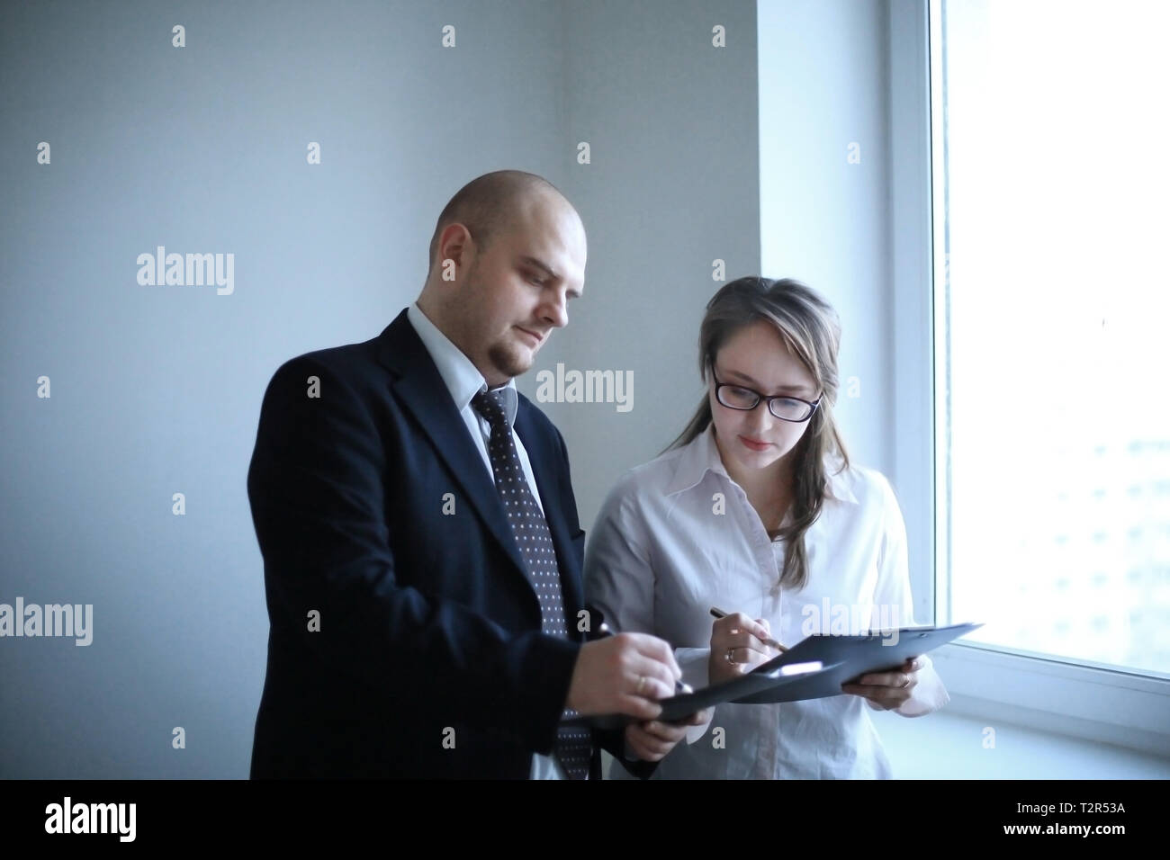 serious businessman and assistant discussing business schedule Stock ...