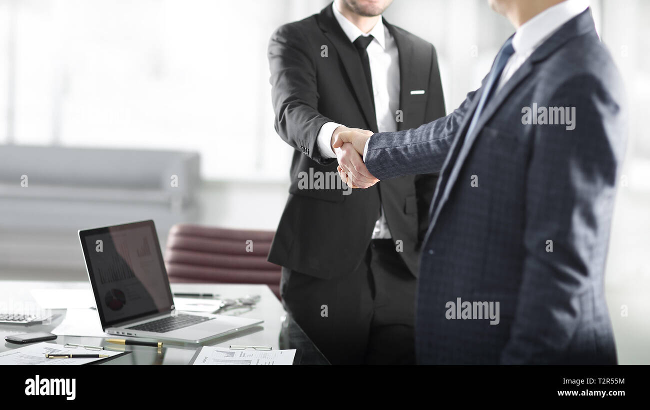 handshake business partners standing next to the Bank office Stock ...