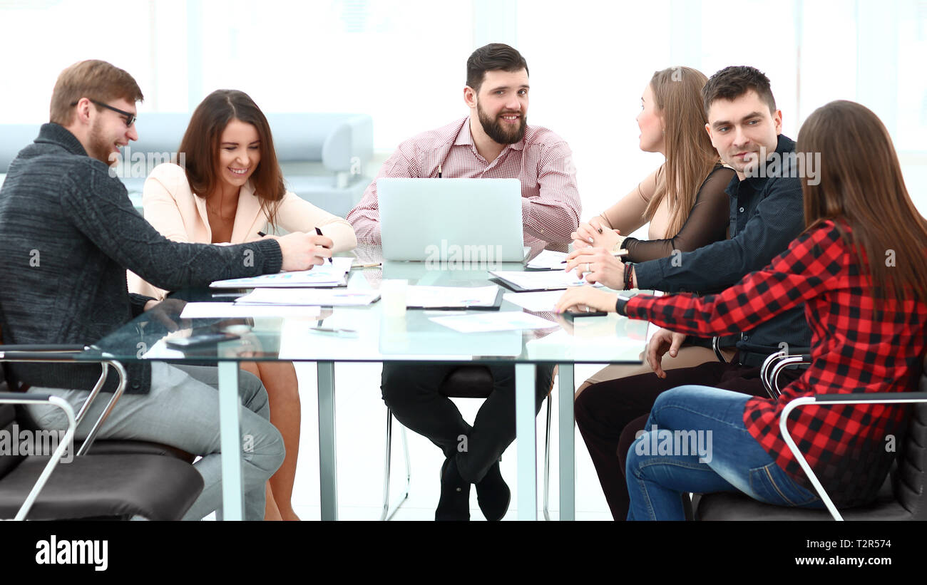 Business people showing team work while working in board room in office ...