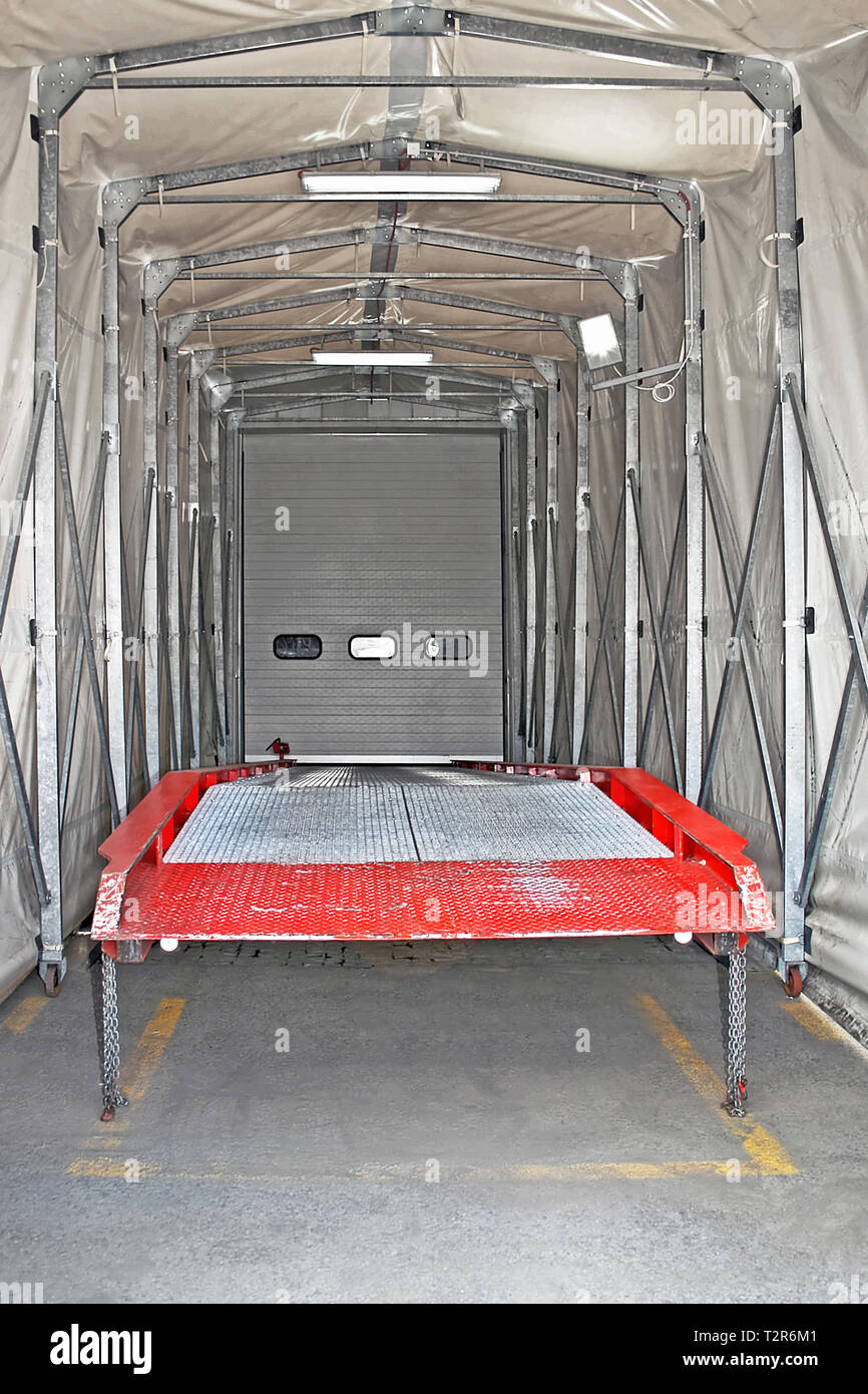 Cargo entrance with flexible tunnel and ramp Stock Photo - Alamy