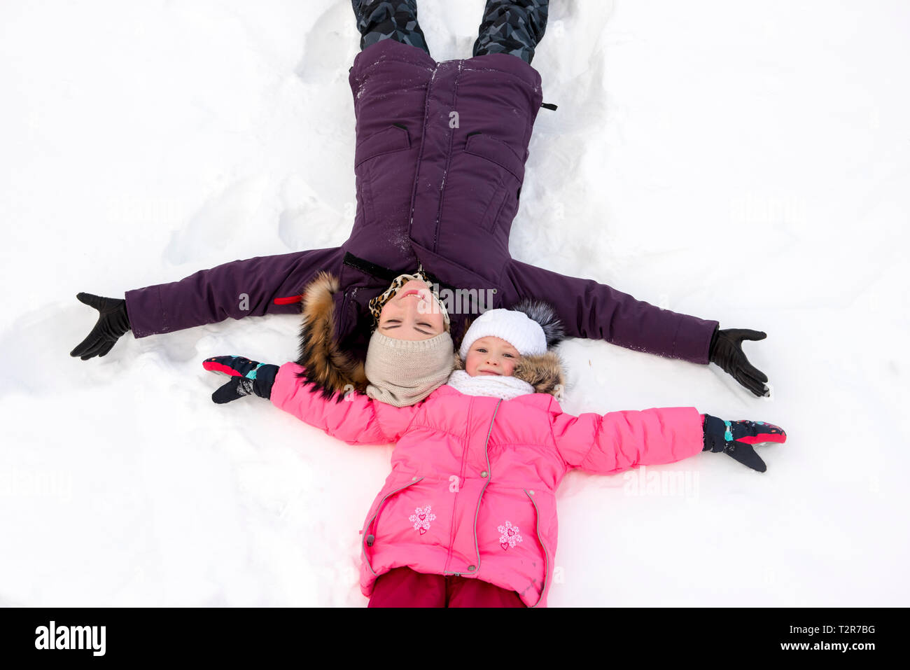 Children making snow angels hi-res stock photography and images - Alamy