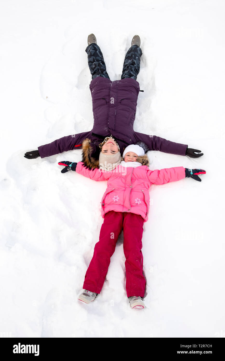 Children making snow angels hi-res stock photography and images - Alamy