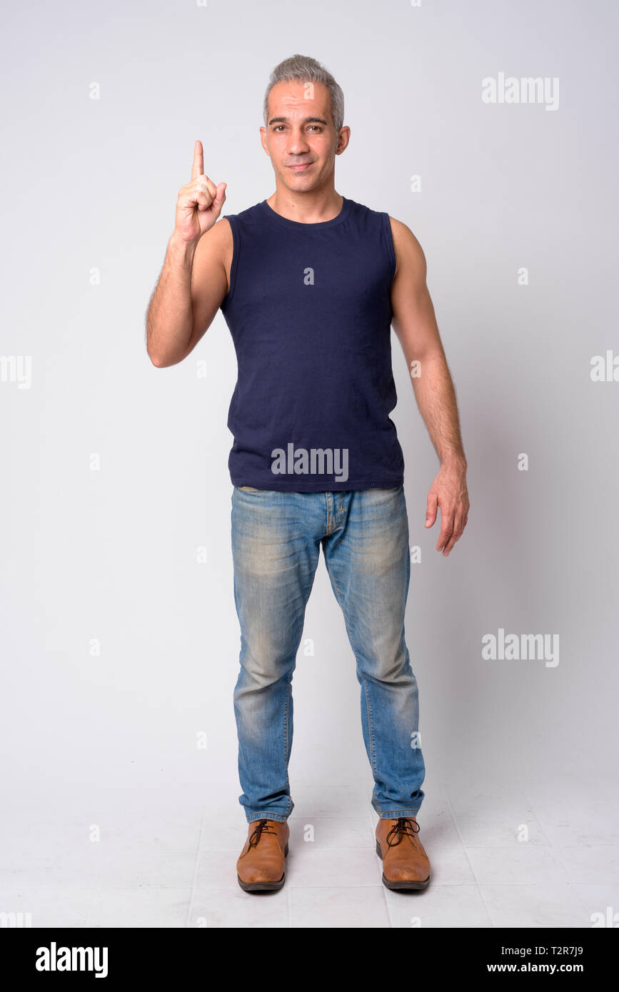 Studio shot of handsome Persian man against white background Stock ...