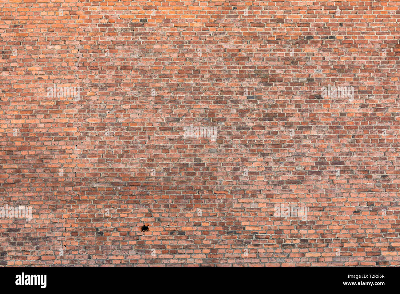 Old messy brick wall texture background exterior Stock Photo - Alamy