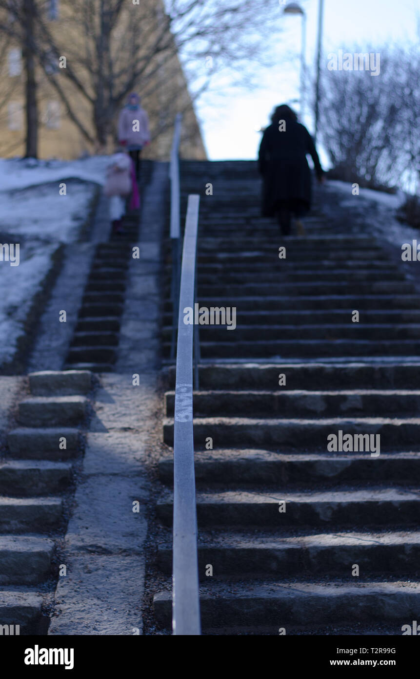 Woman standing on top of stairs hi-res stock photography and images - Alamy