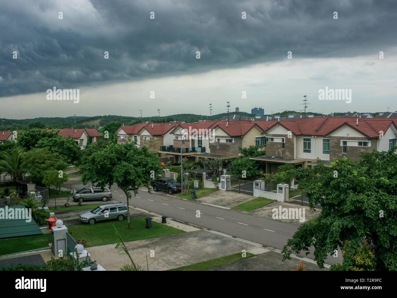 Storm clouds over a gated housing development, Iskandar Puteri ...