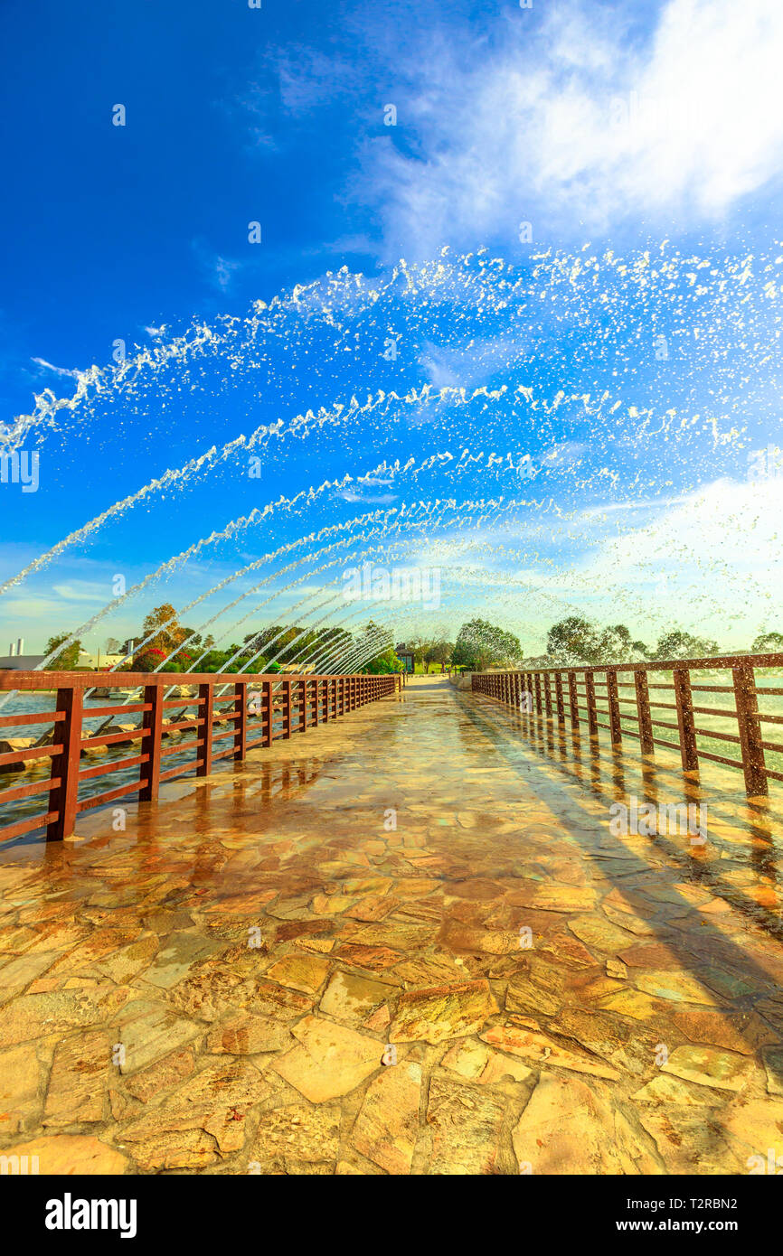 Bridge with fountain in Aspire park, Doha's biggest park, located in ...