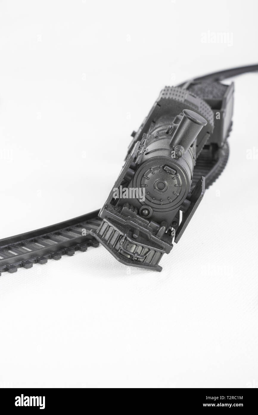 Black painted toy steam engine model. For off track, financial crash ...