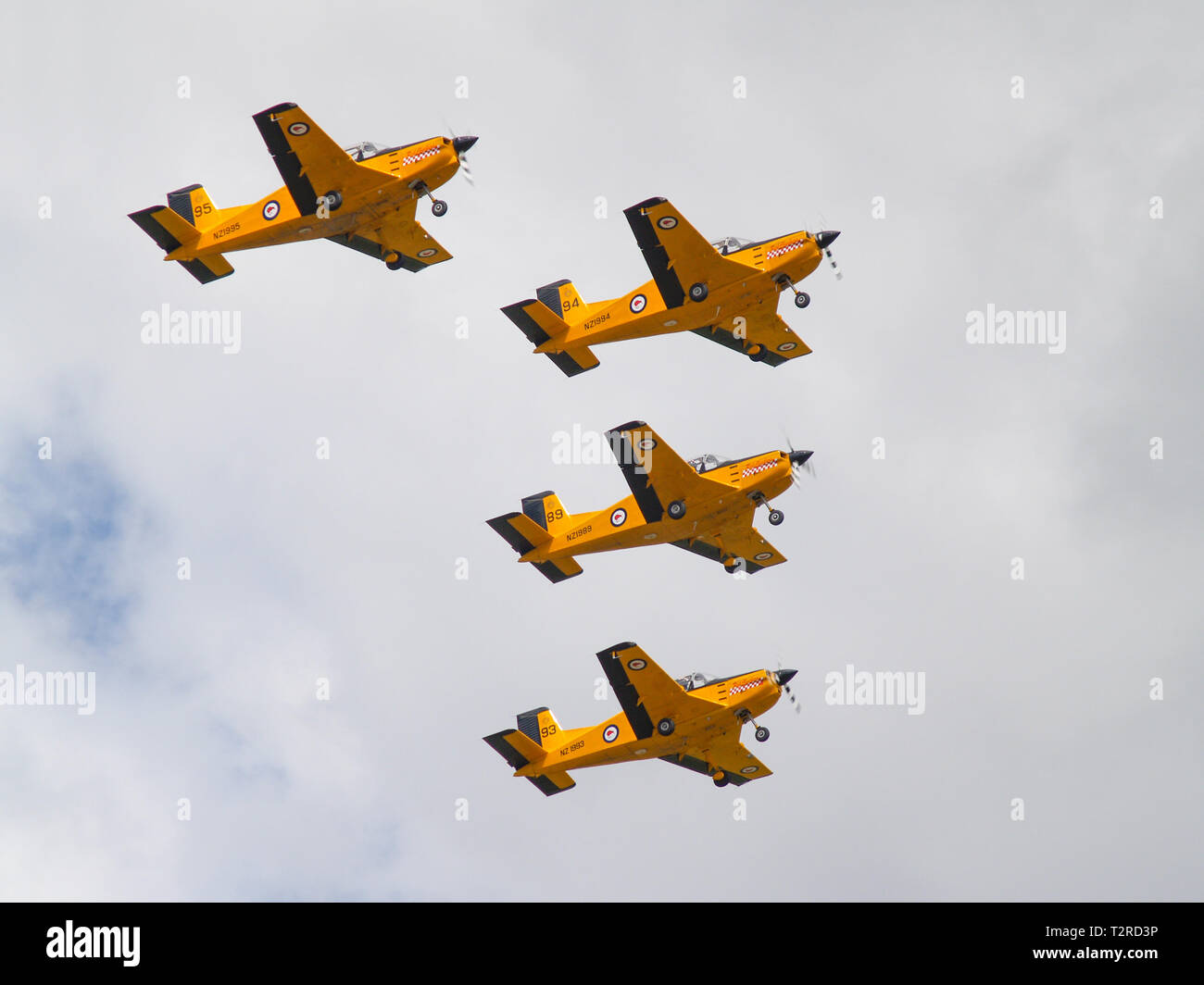 Four yellow planes in formation hi-res stock photography and images - Alamy