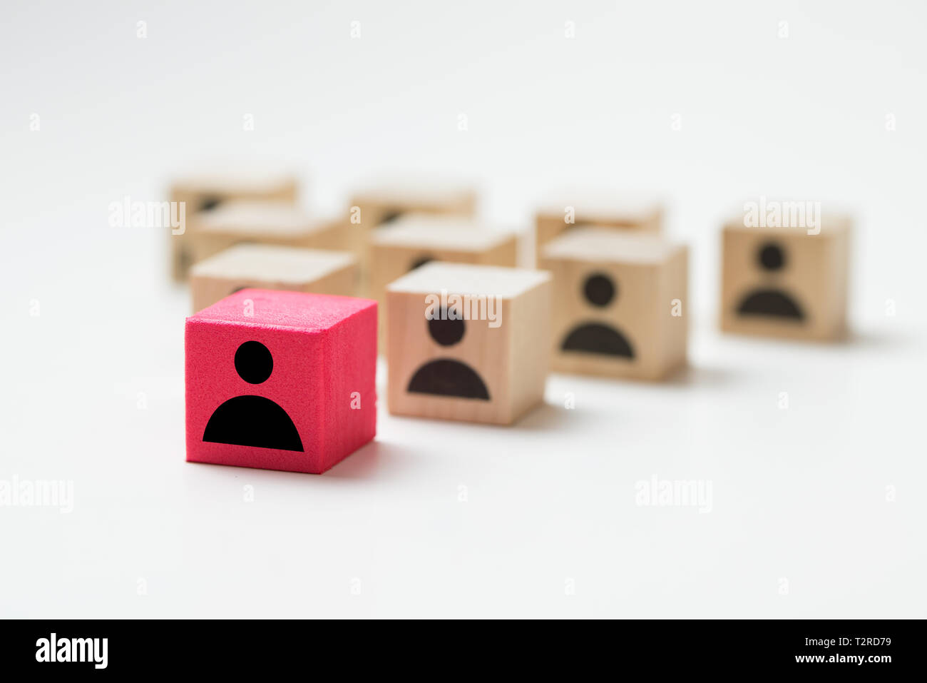 Leadership concept using red people icon cube among many other cubes ...