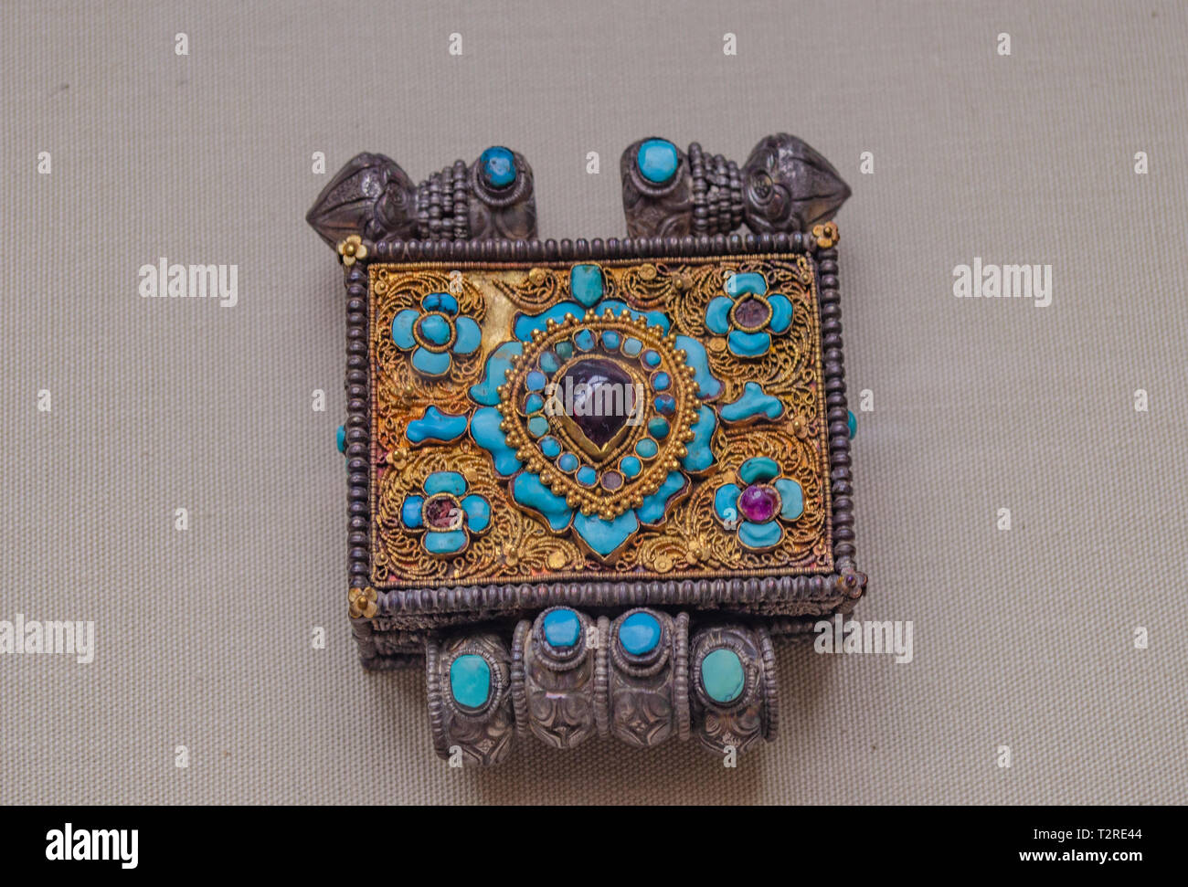 Ornamented amulet cases. Turquoise set in silver and with garnets in ...