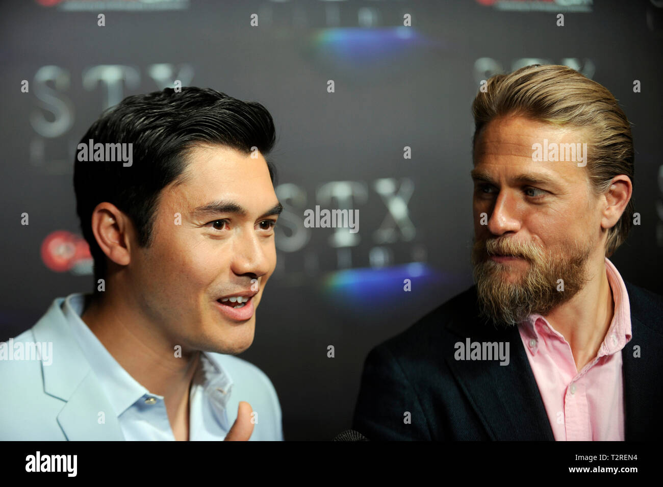 Actors Henry Golding and Charlie Hunnam arrives at the STXfilms ...