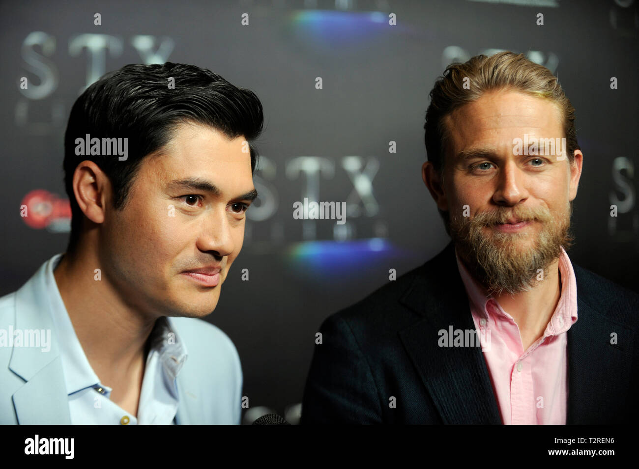Actors Henry Golding and Charlie Hunnam arrives at the STXfilms ...