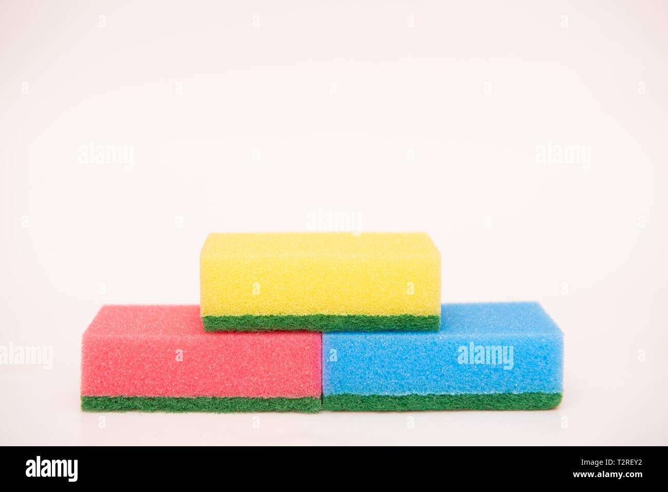 three colors sponges for dishes Stock Photo - Alamy