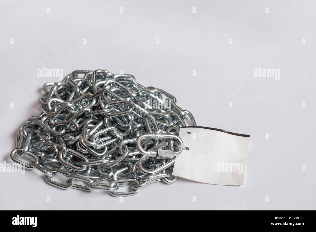 stainless chain with label Stock Photo - Alamy