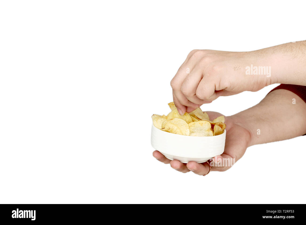 Hand in bag of chips hi-res stock photography and images - Alamy