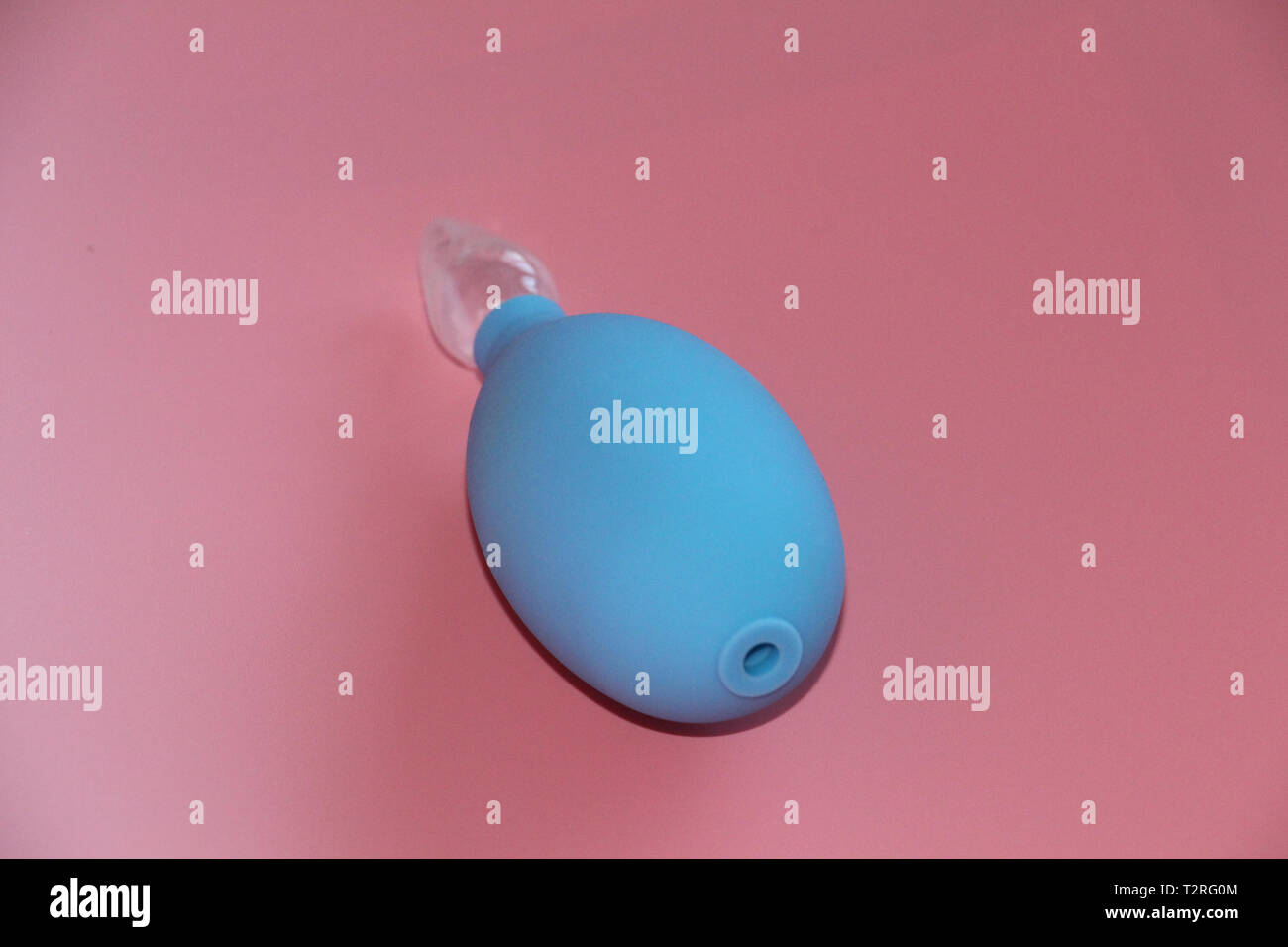 Blue nasal aspirator with glass tip. Suction of discharge from the baby ...
