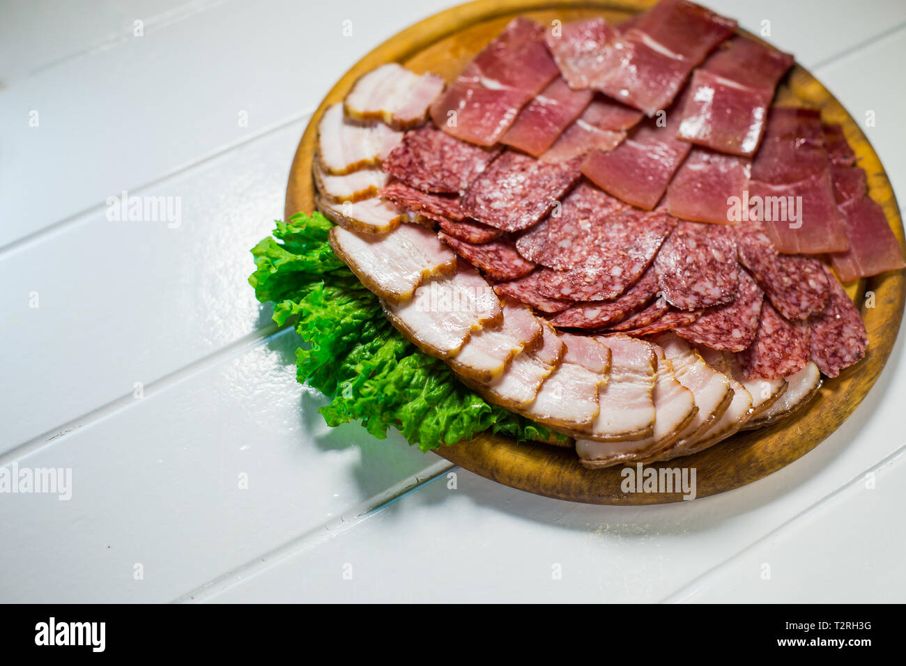 Meat plate set with salami, bacon, hamon on a white background Stock ...